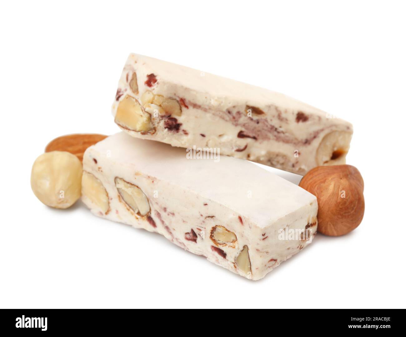 Pieces of delicious nougat and nuts on white background Stock Photo - Alamy