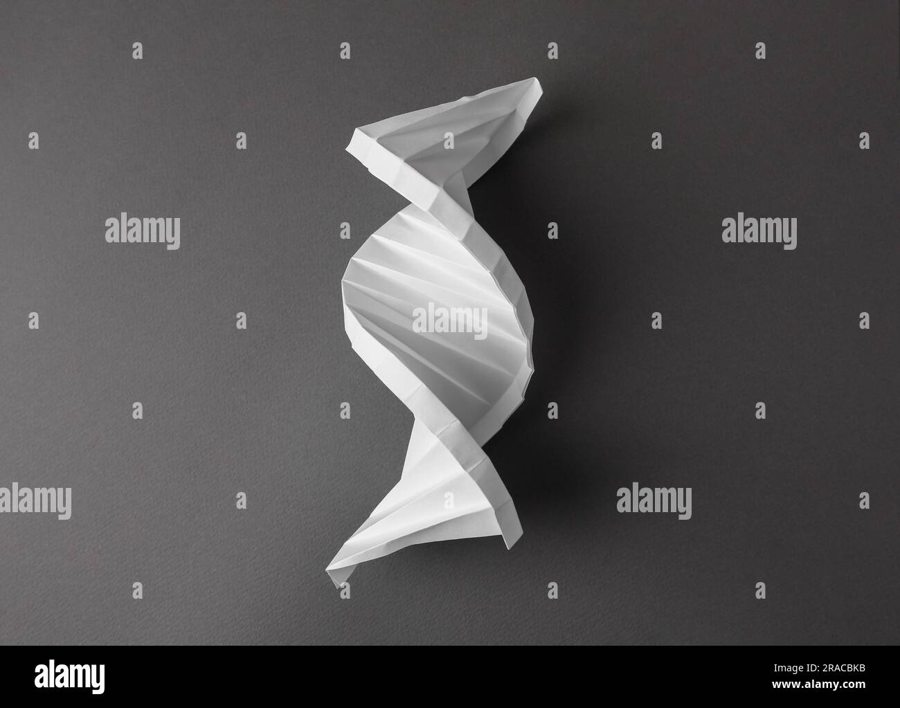 Paper model of DNA molecular chain on black background, top view Stock ...