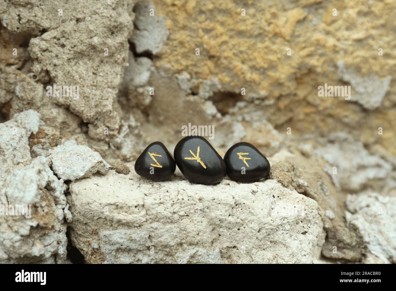 Black runes on stone outdoors. Old Germanic alphabet Stock Photo - Alamy