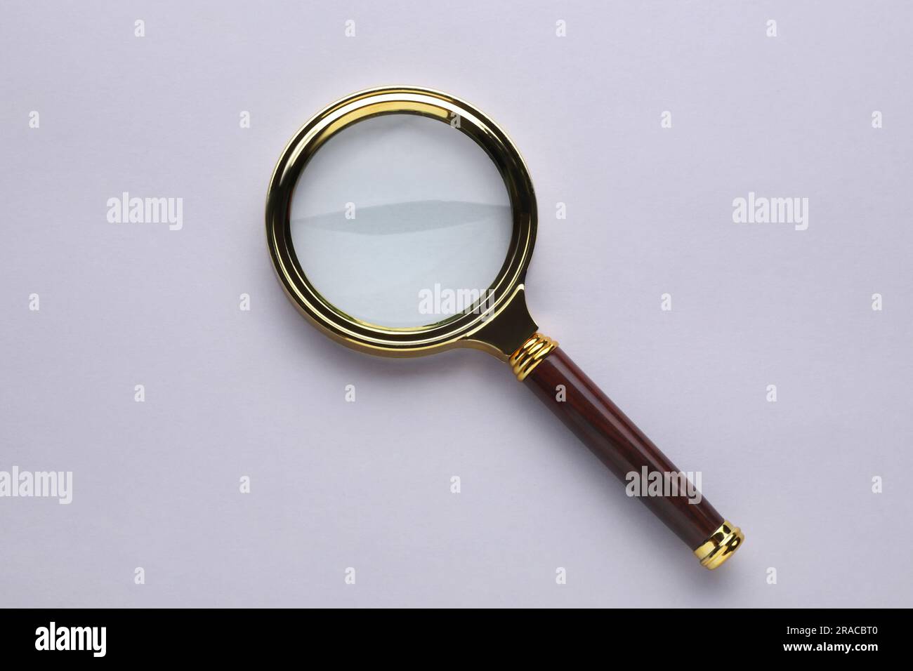Magnifying glass on light grey background, top view Stock Photo - Alamy
