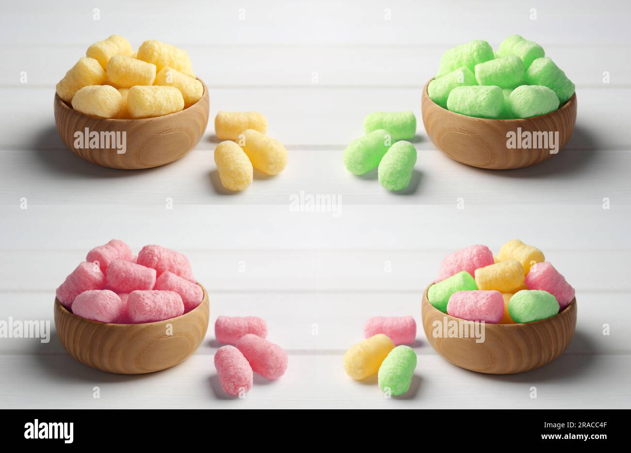 Collage of bowls with colorful corn puffs on white wooden table Stock ...