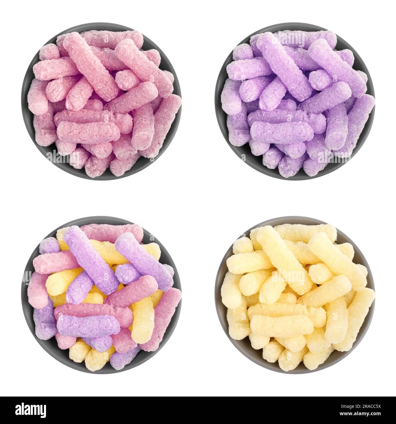 Set of bowls with colorful corn puffs on white background, top view ...