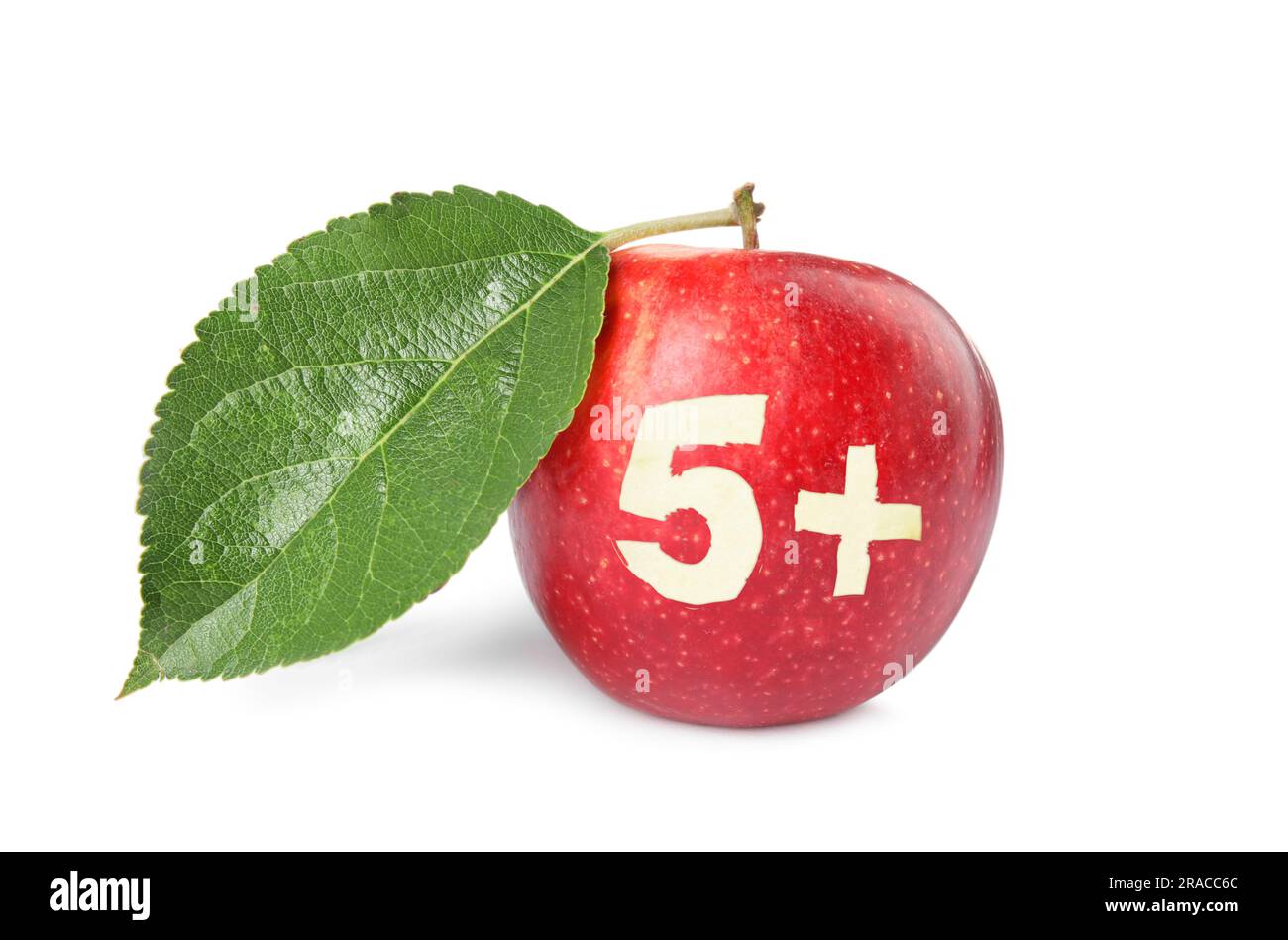 Red apple with carved number five and plus symbol as school grade on ...
