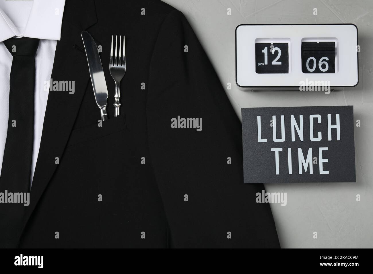Creative business lunch layout. Men's jacket with cutlery in pocket ...