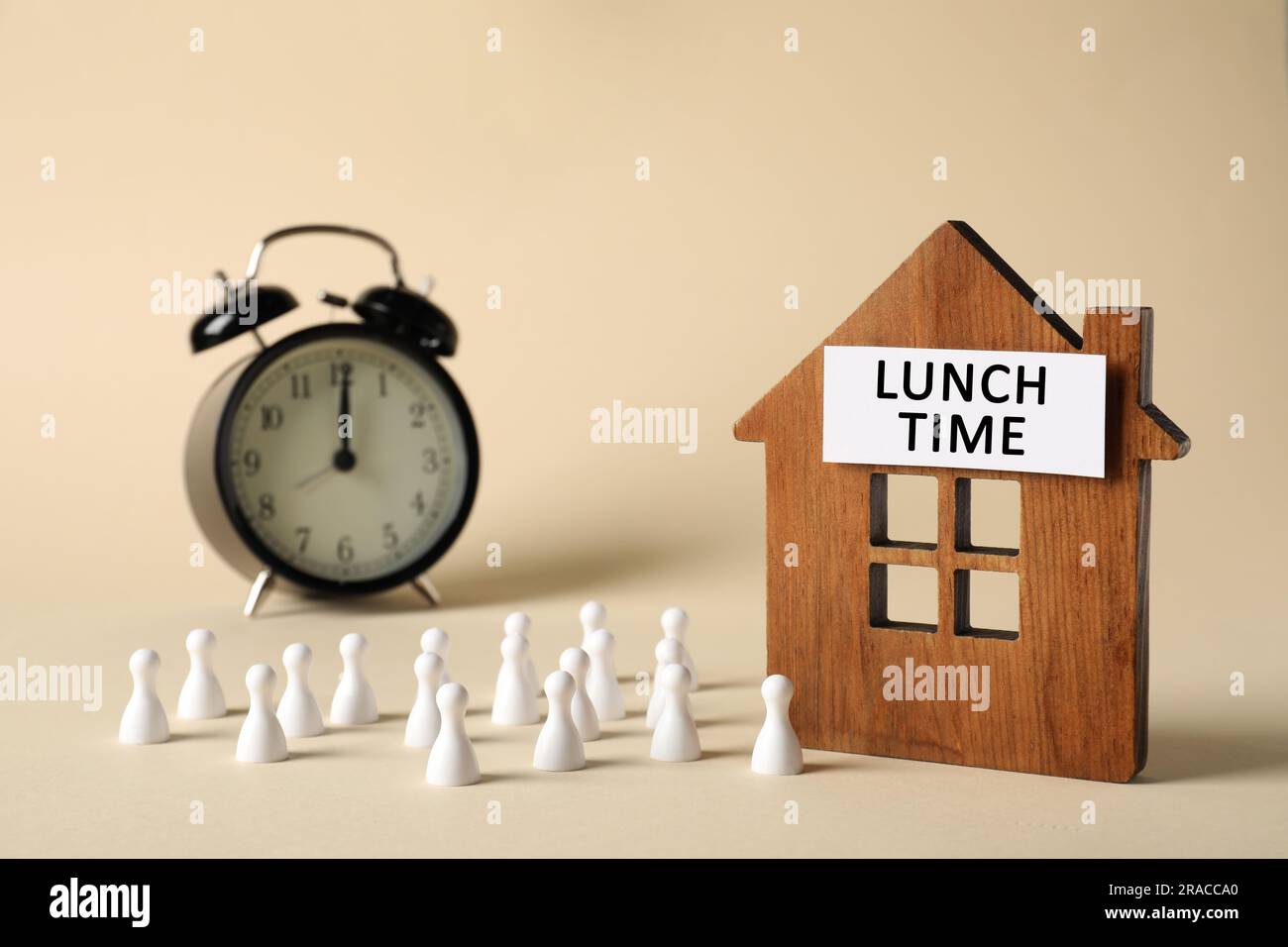 Business lunch time. Composition with chess pieces as employees, wooden ...