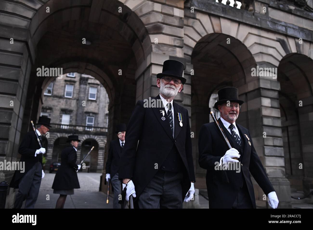 An early morning procession rehearsal takes place along the Royal Mile ...