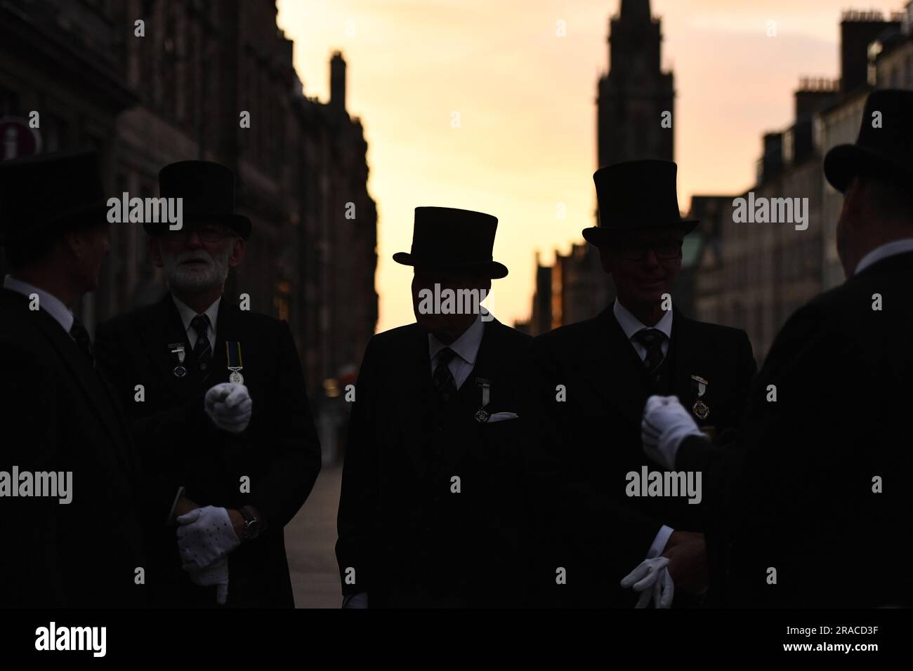 An early morning procession rehearsal takes place along the Royal Mile ...