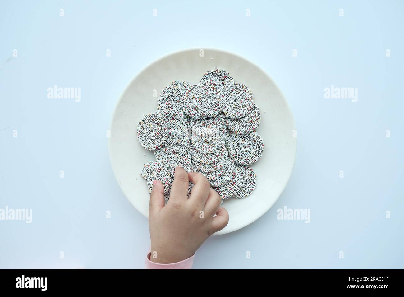 top view of child hand pick sweet cookies Stock Photo - Alamy