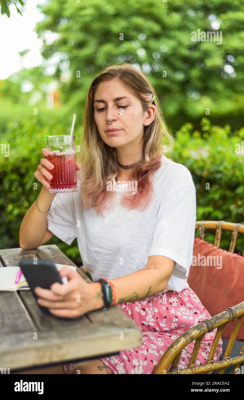 Woman scrolling phone hi-res stock photography and images - Alamy