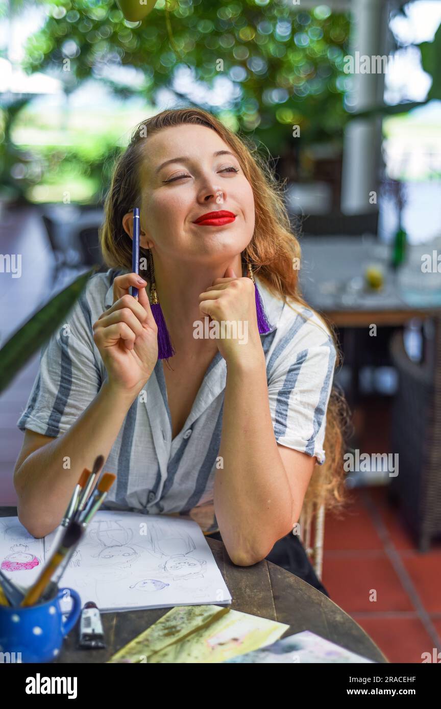 Woman thinking with pen pencil hi-res stock photography and images - Alamy