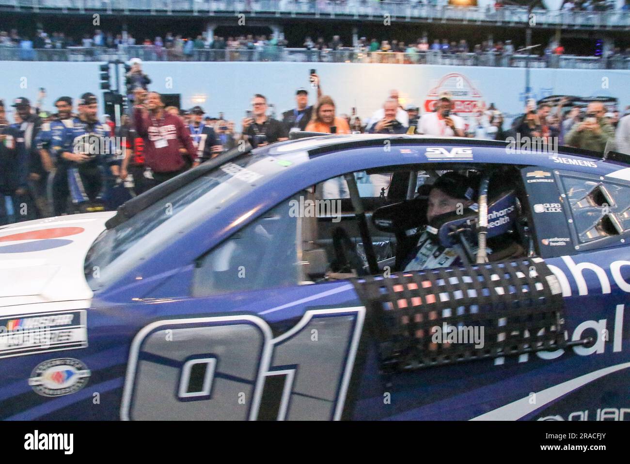 Shane van Gisbergen does some donuts in victory lane after getting ...