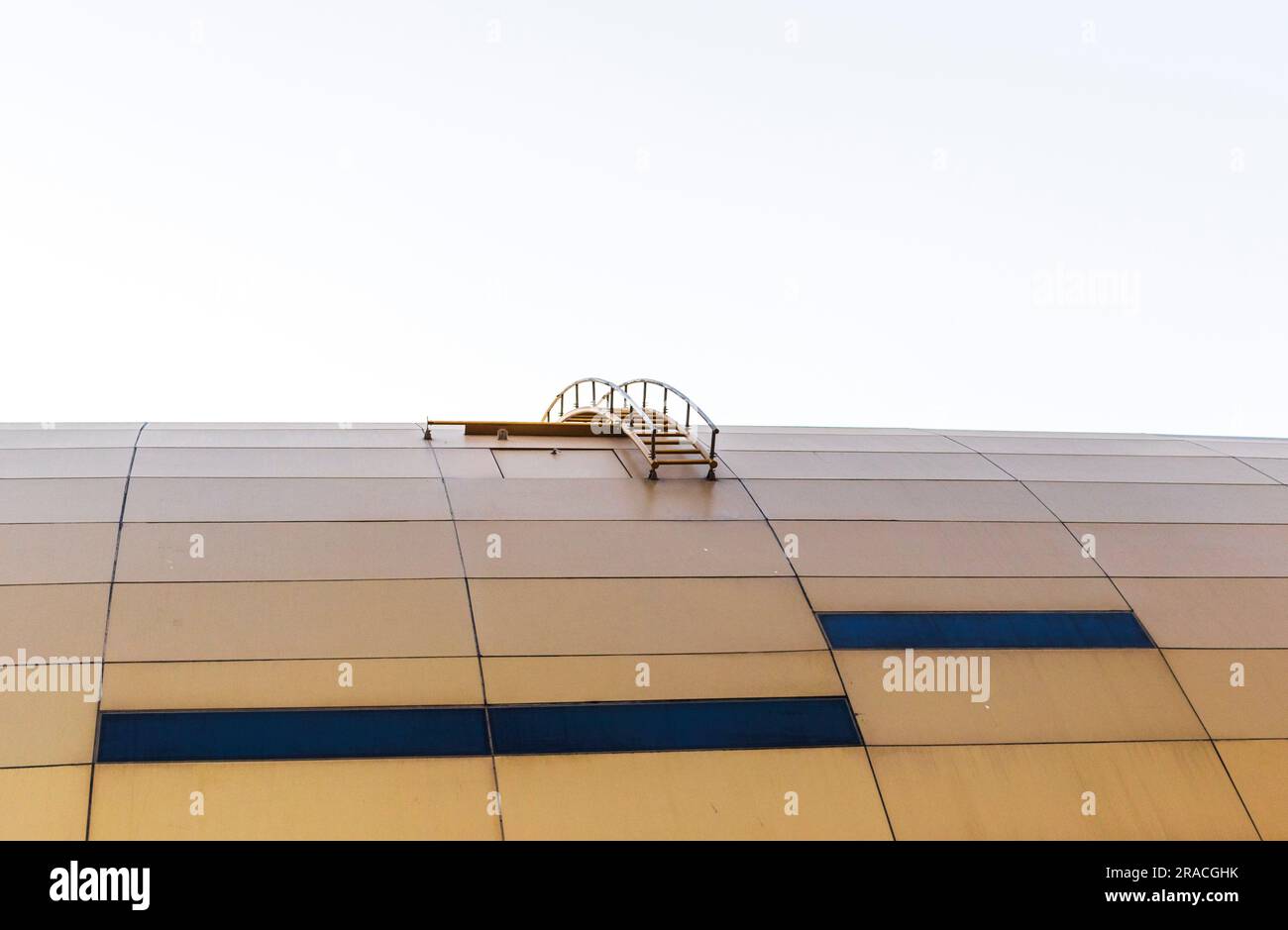 Concept shot of the curved ladder on the roof of the steel structure ...
