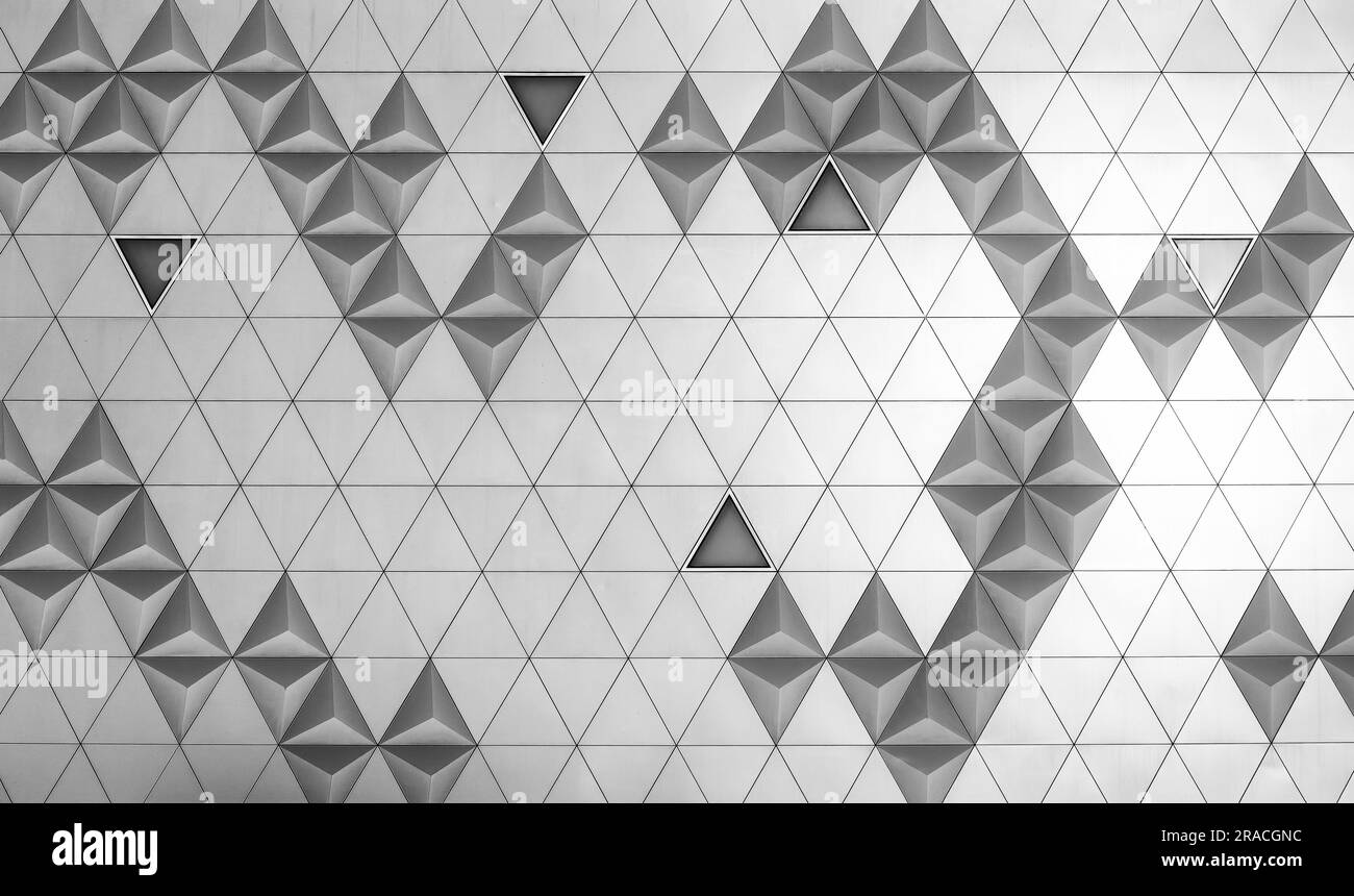 Steel diamond-shaped polished metal cladding panels of a modern ...