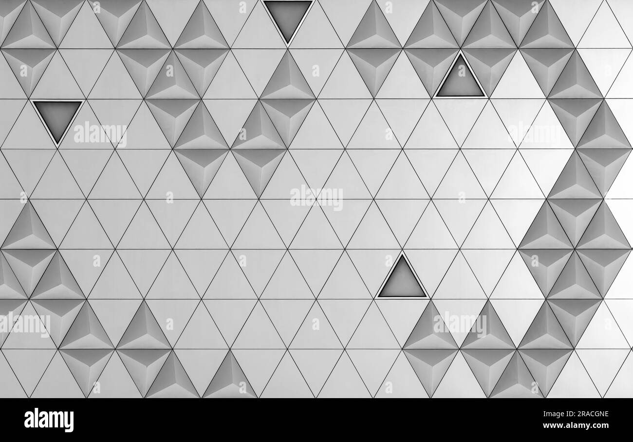 Steel diamond-shaped polished metal cladding panels of a modern ...