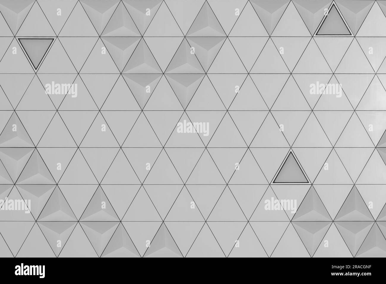 Steel diamond-shaped polished metal cladding panels of a modern ...