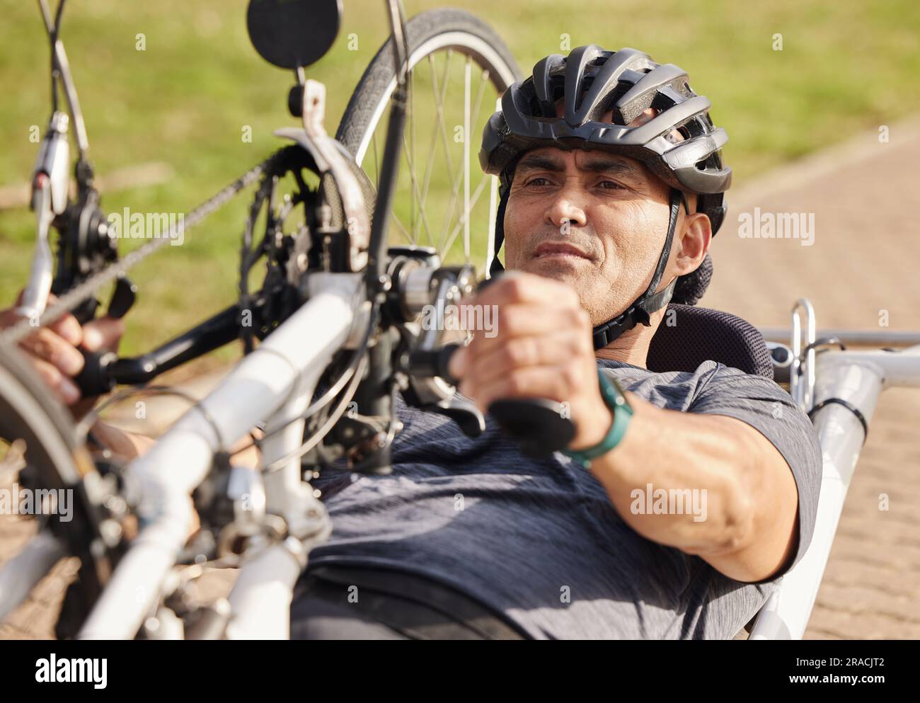 Man with disability, handbike and cycling outdoor for sports, race and ...