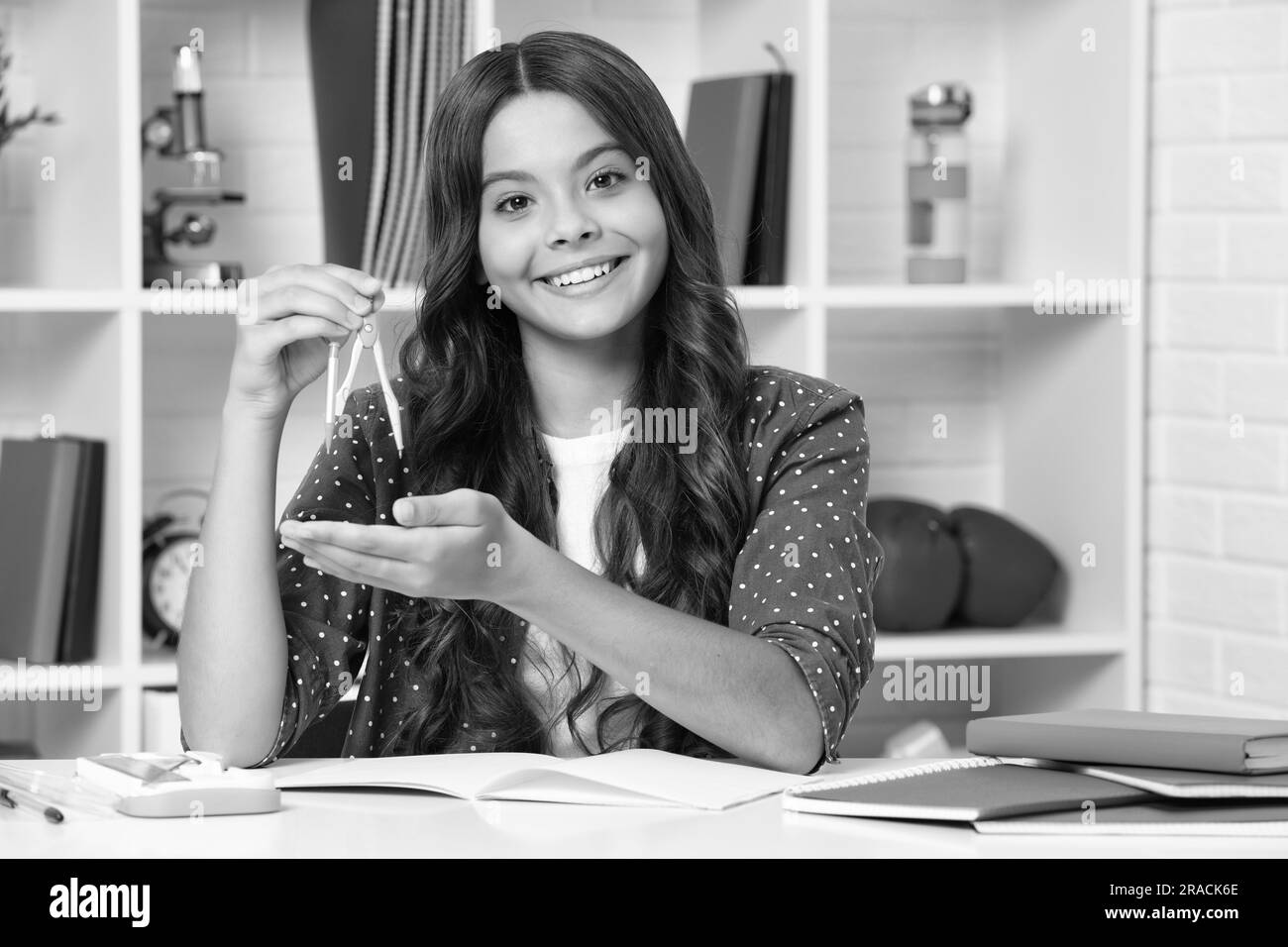School teenager child girl measuring with compass divider. Geometry ...