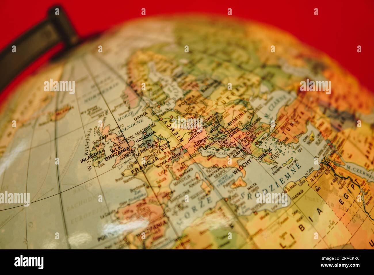 detail of europe on a globe model with political map on the red ...