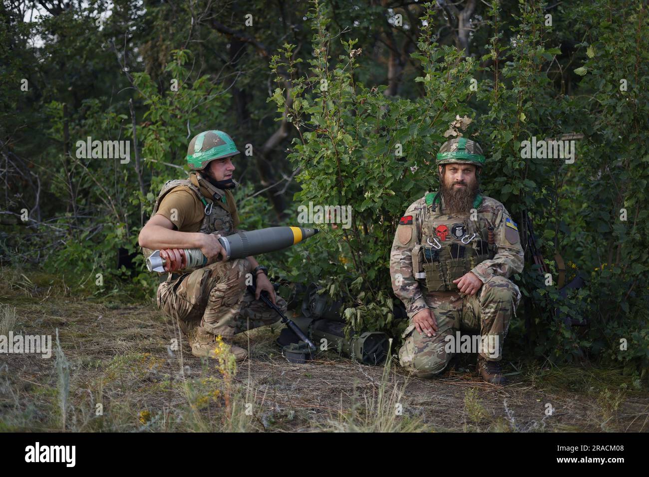 A Ukrainian serviceman, left, of the 3rd Assault Brigade, with another ...