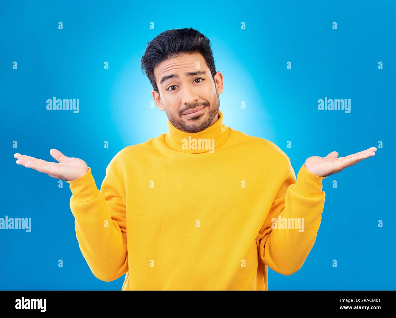 Doubt, shrug and portrait of a man in a studio with a confused hand ...