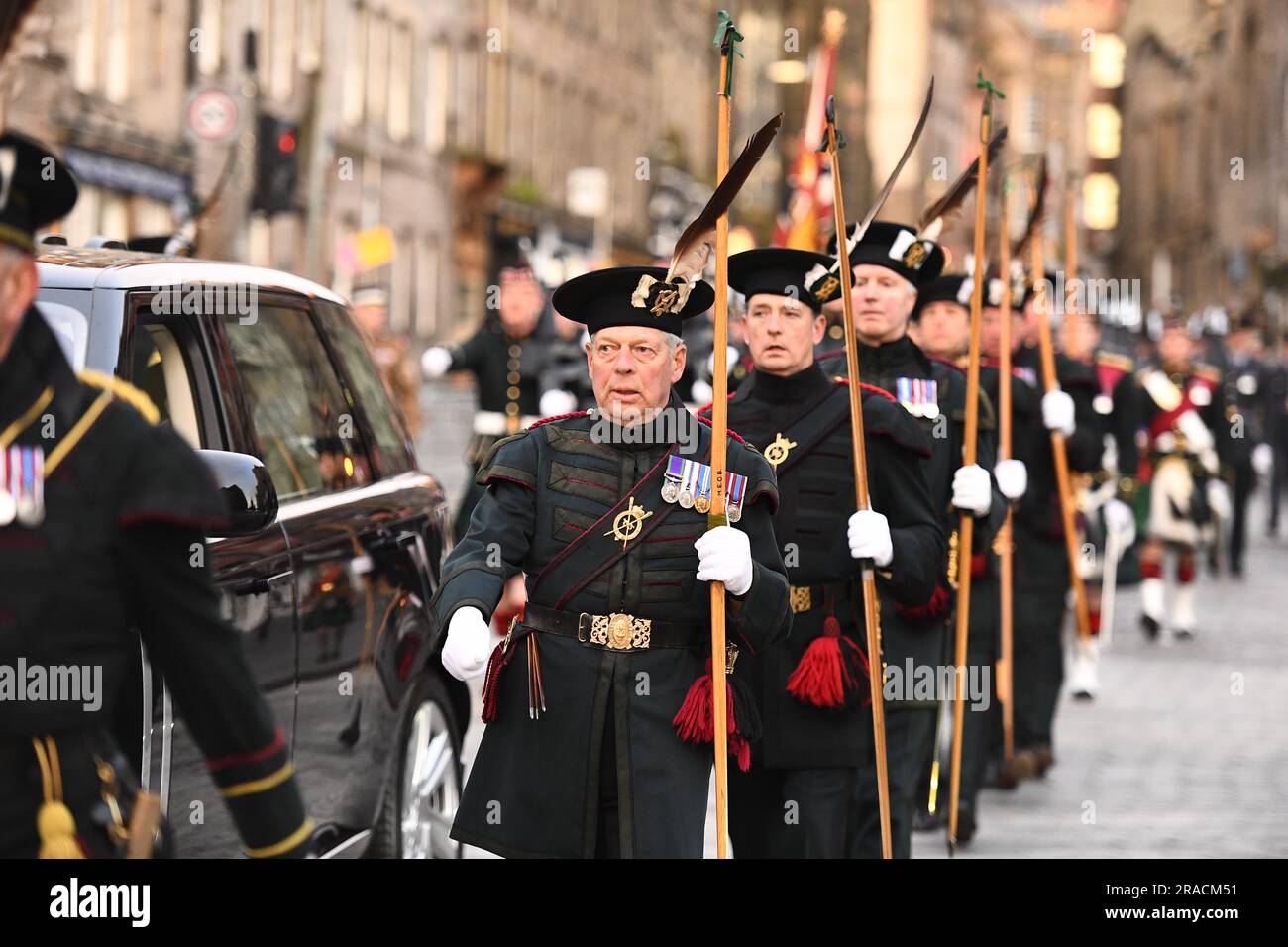 An early morning procession rehearsal takes place along the Royal Mile ...