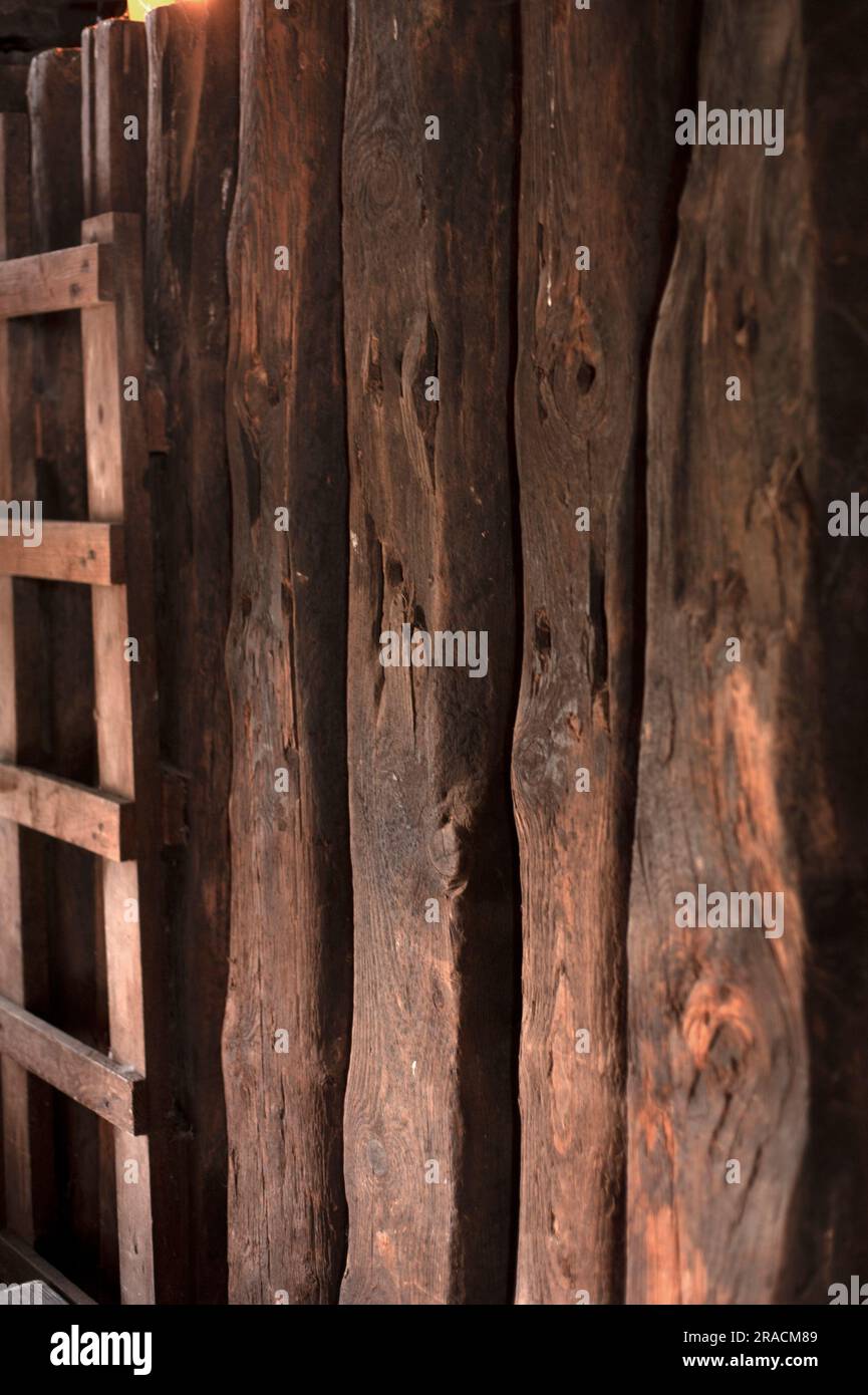 Ancient wooden post wall and simple ladder Stock Photo - Alamy
