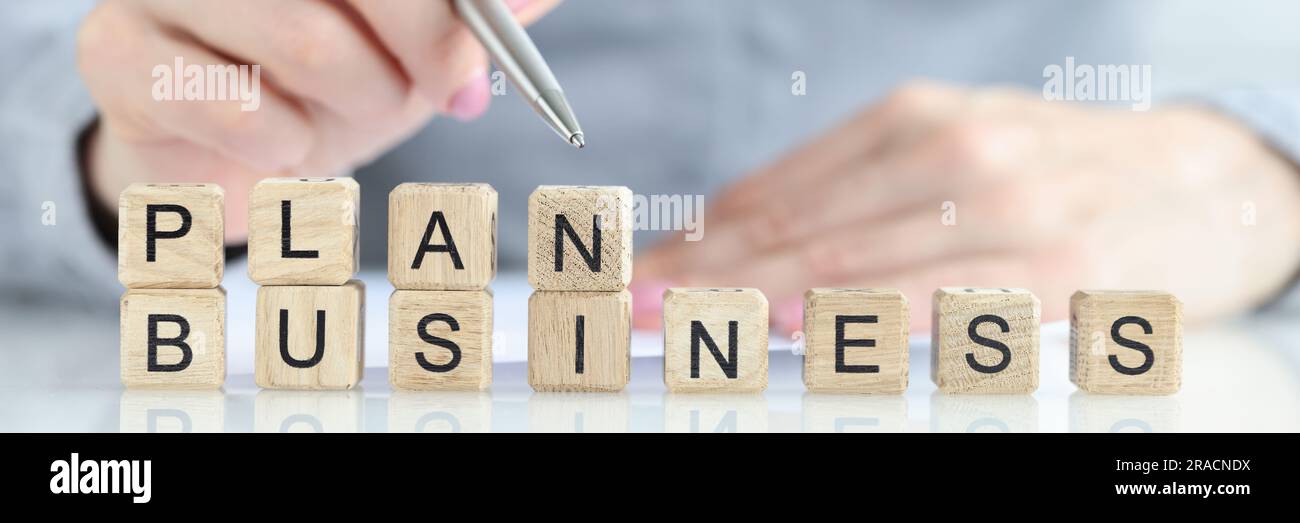 Businesswoman pointing words plan hi-res stock photography and images ...
