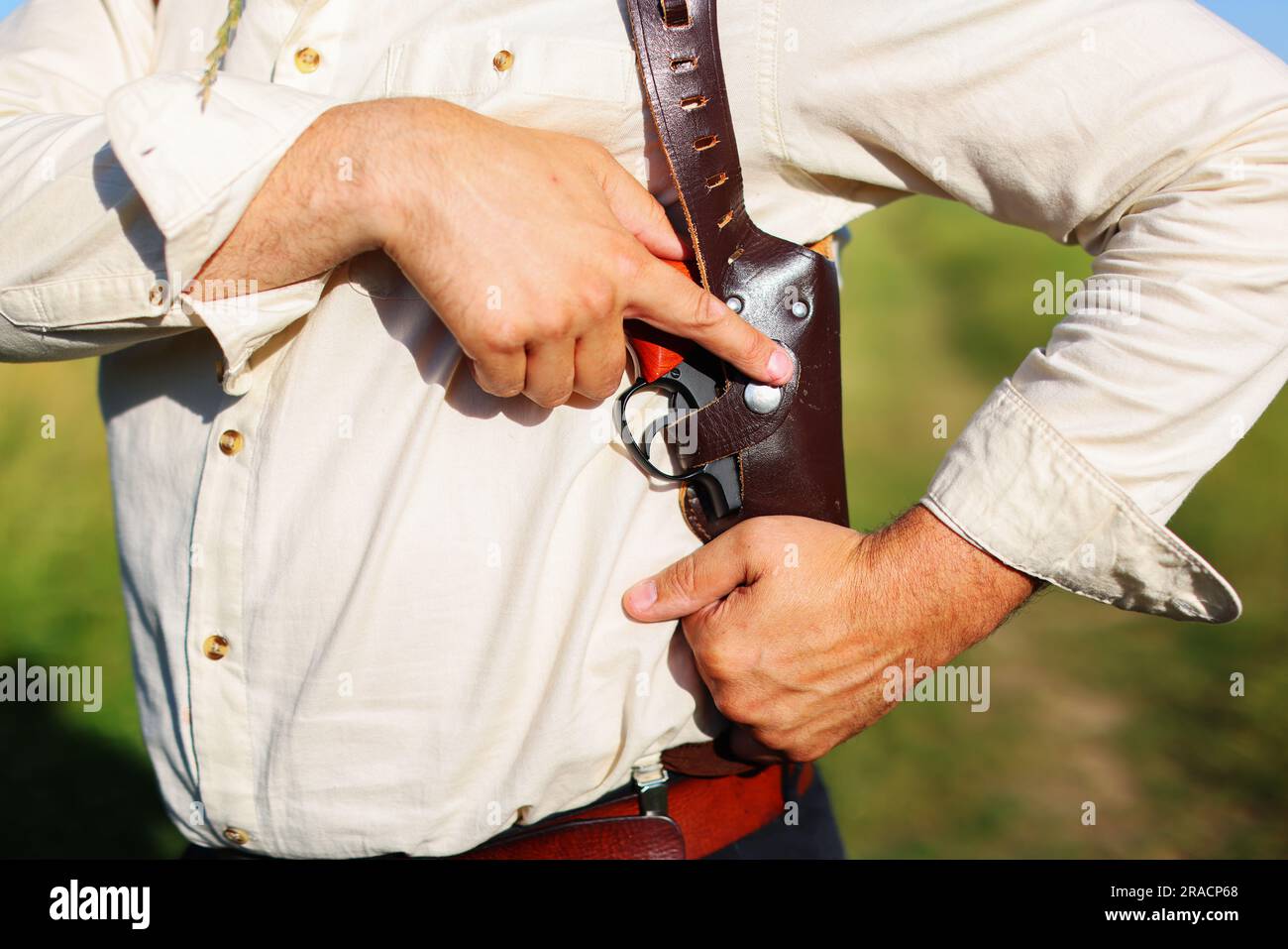 criminal police detective man holding revolver gun Stock Photo - Alamy