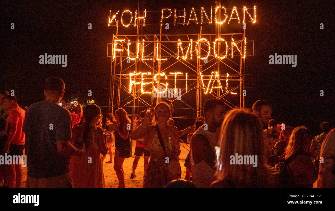 People attend the Full Moon Party on Hat Rin beach on Koh Phangan ...