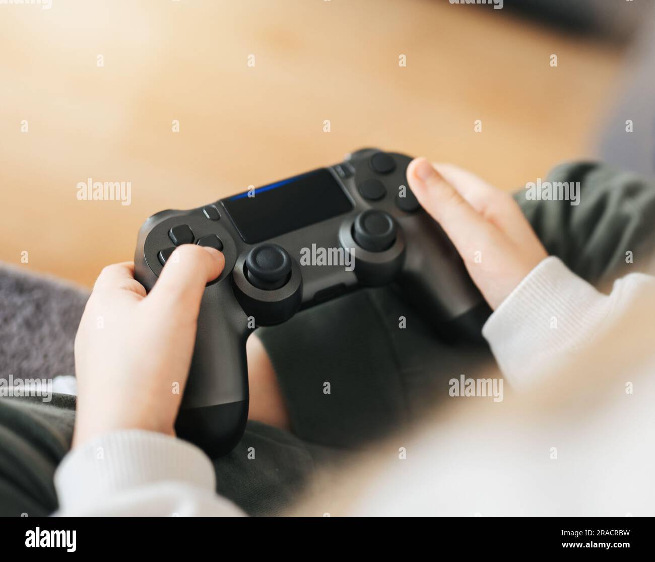 Hand holding video game controller hi-res stock photography and images ...
