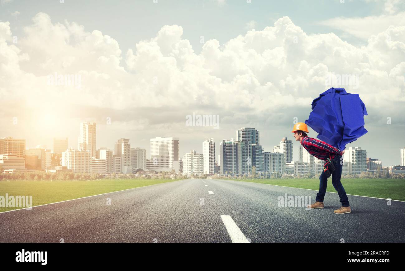 Engineer man carry load Stock Photo - Alamy