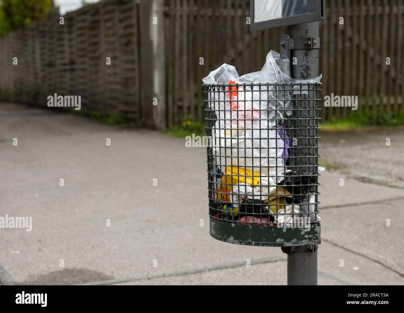 many trash can in row in city urban environment.basket full of garbage ...