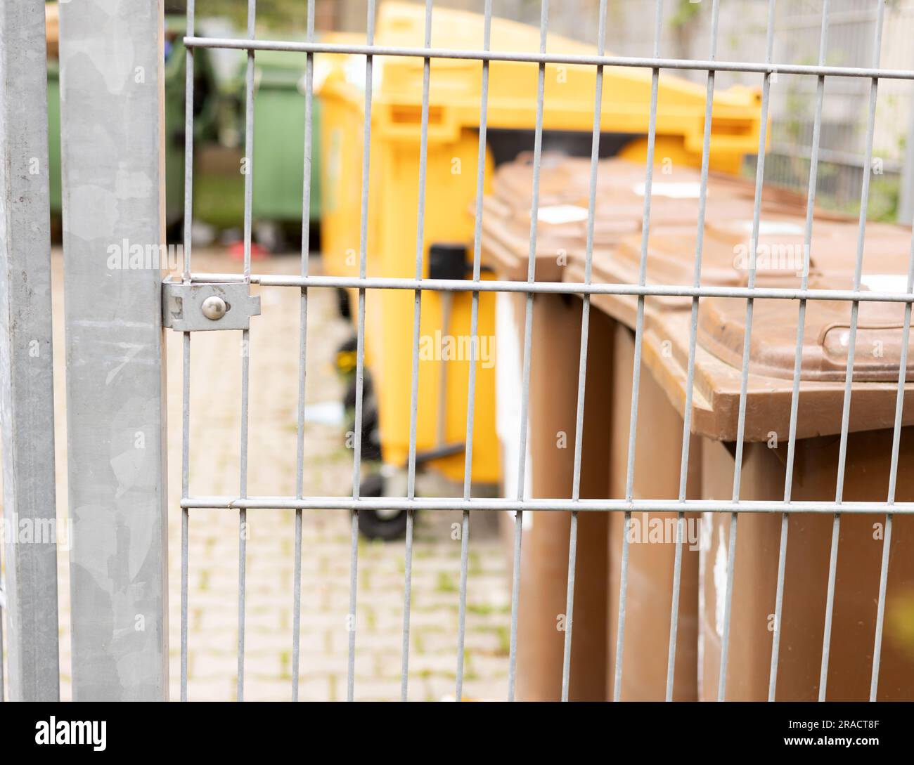 many trash can in row in city urban environment.basket full of garbage ...