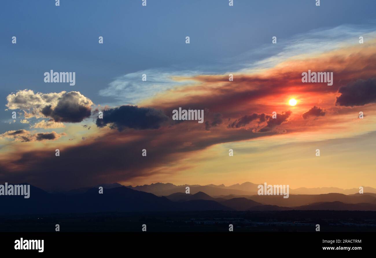colorful sunset over the front range of the rocky mountains through the ...