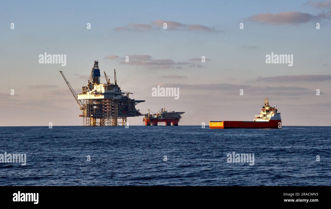 Jack up oil rig and semi submersible platform, during cargo operations ...