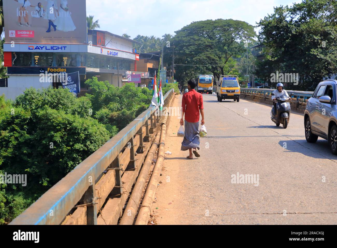 December 29 2022 - Kannur district, Kerala in India: Indian Traffic on dusty streets Stock Photo ...