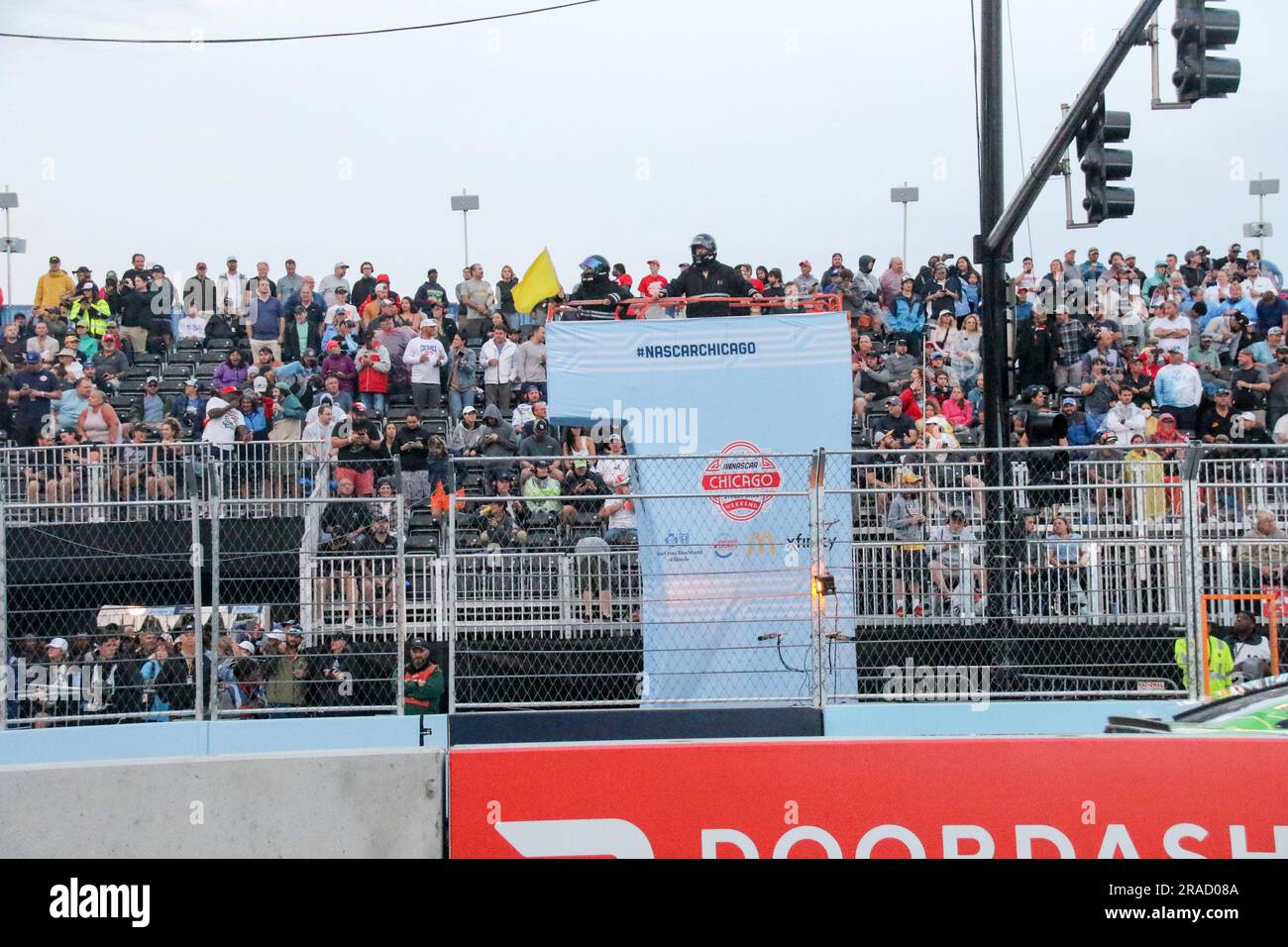 A yellow flag is waived signaling to use caution on the track during ...