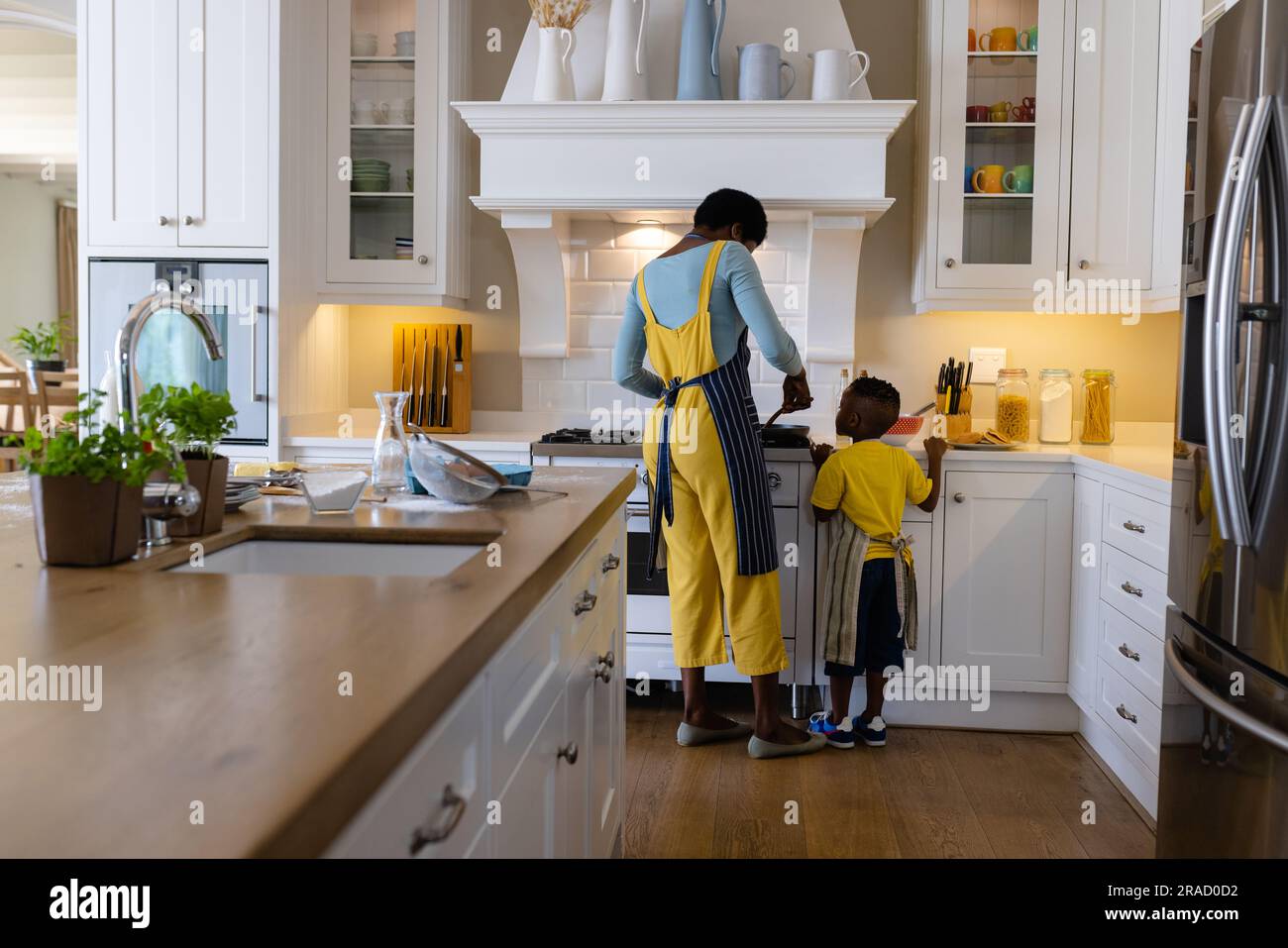 Mother son cooking in kitchen hi-res stock photography and images - Alamy