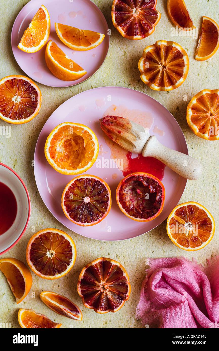 Sicilian oranges, halved and partially squeezed Stock Photo - Alamy