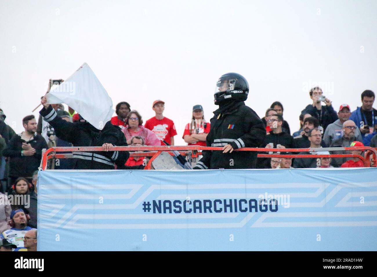 A white flag is waived signaling the last lap of the 2-lap overtime to ...