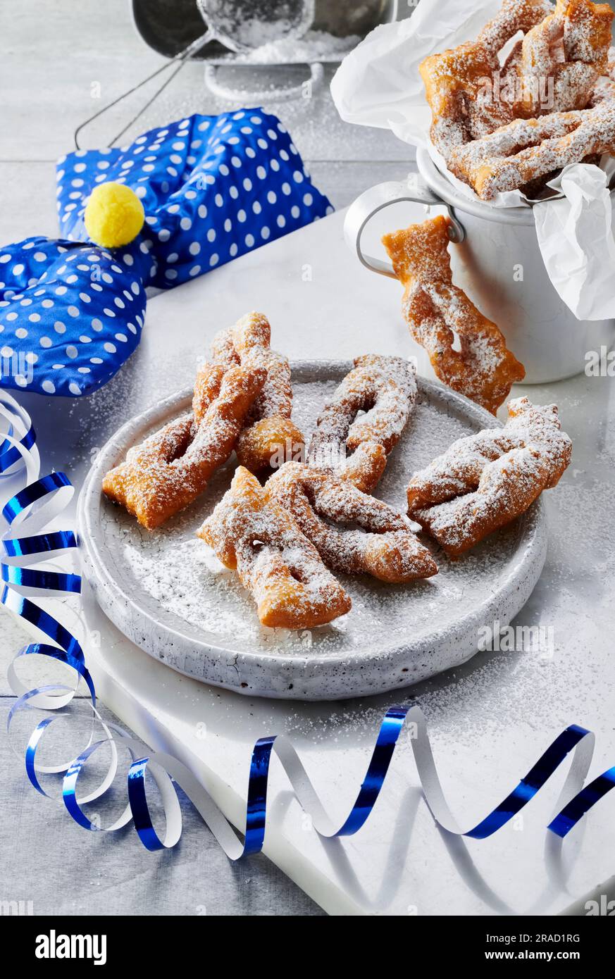 Fried Dough Twists with Powdered Sugar Stock Photo - Alamy
