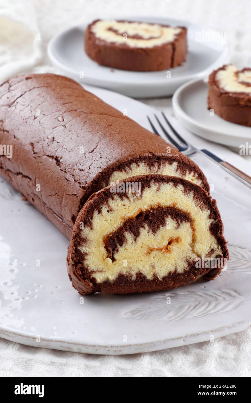 Hurricane Swiss roll (sponge roll) with cocoa Stock Photo - Alamy