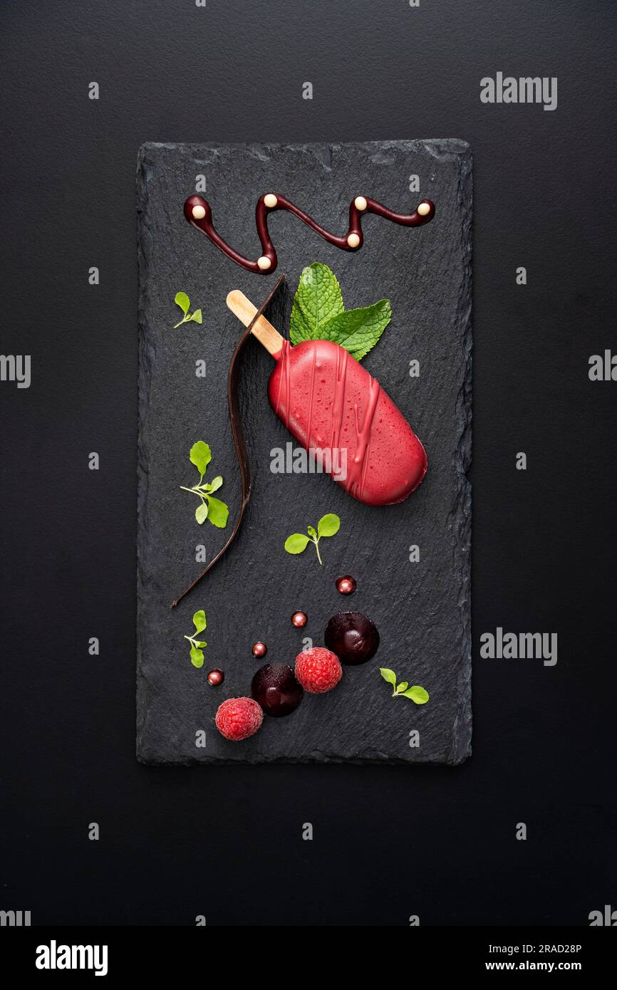 Raspberry ice cream on a stick Stock Photo - Alamy