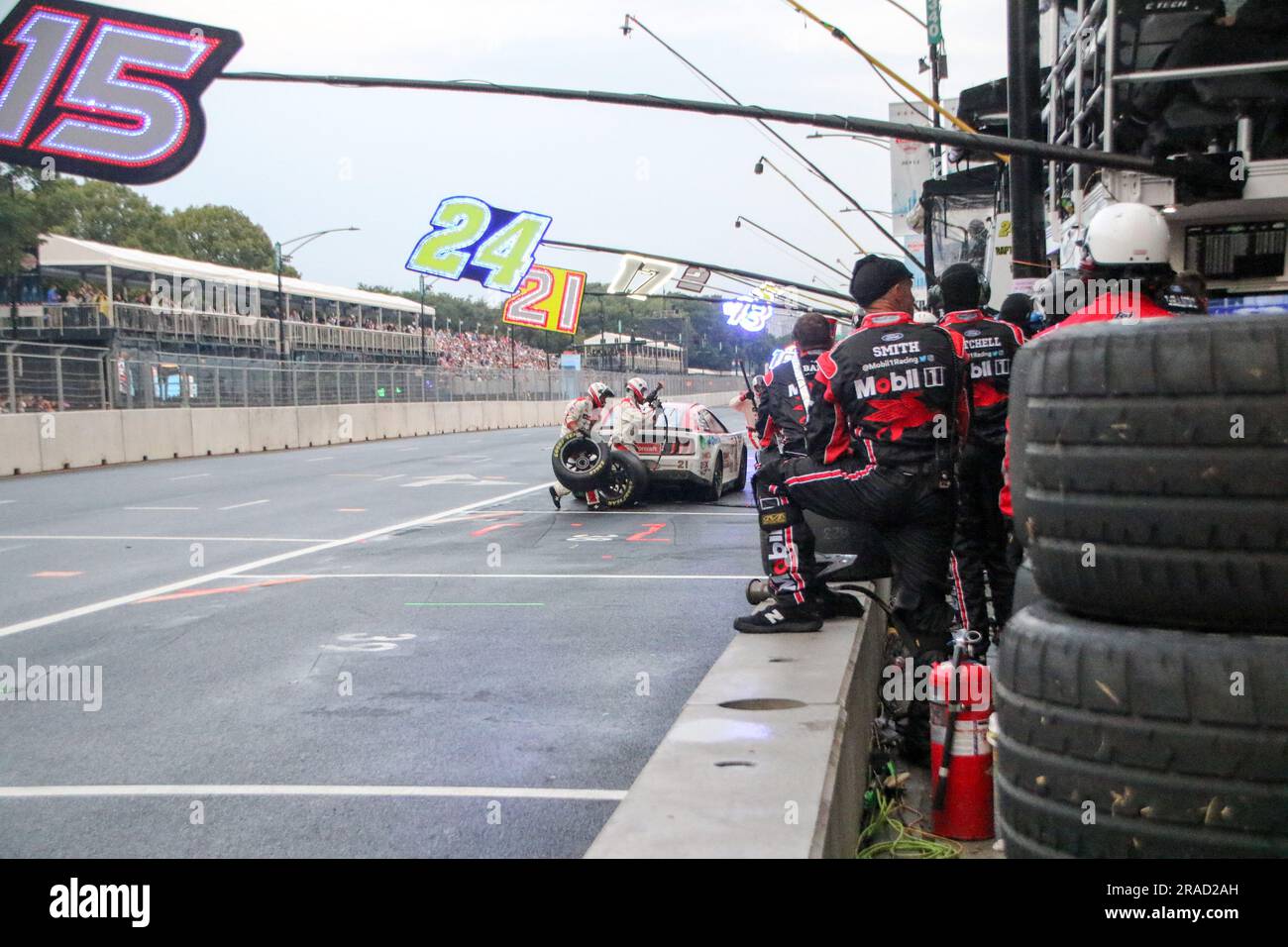 Tires get changed on one of the cars on pit road during the NASCAR Cup ...