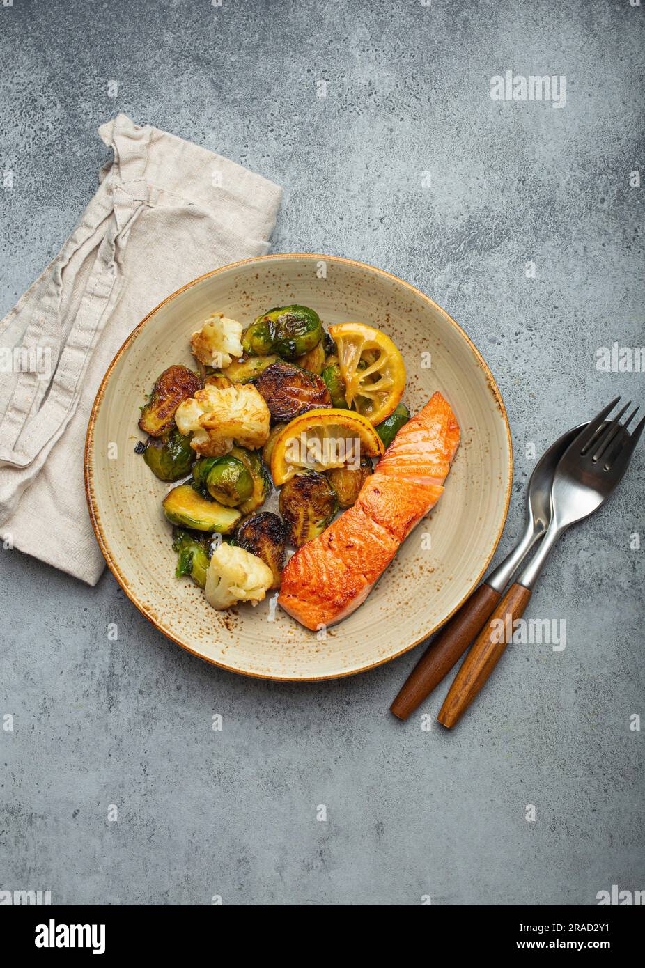 Salmon fillet with grilled Brussels sprouts Stock Photo - Alamy