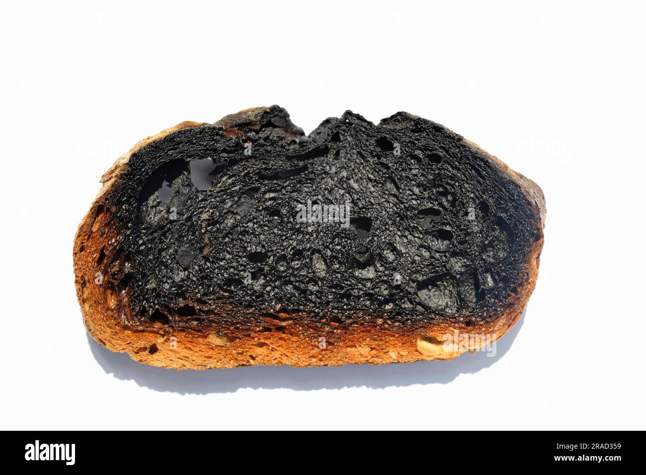Burnt slice of bread Stock Photo - Alamy