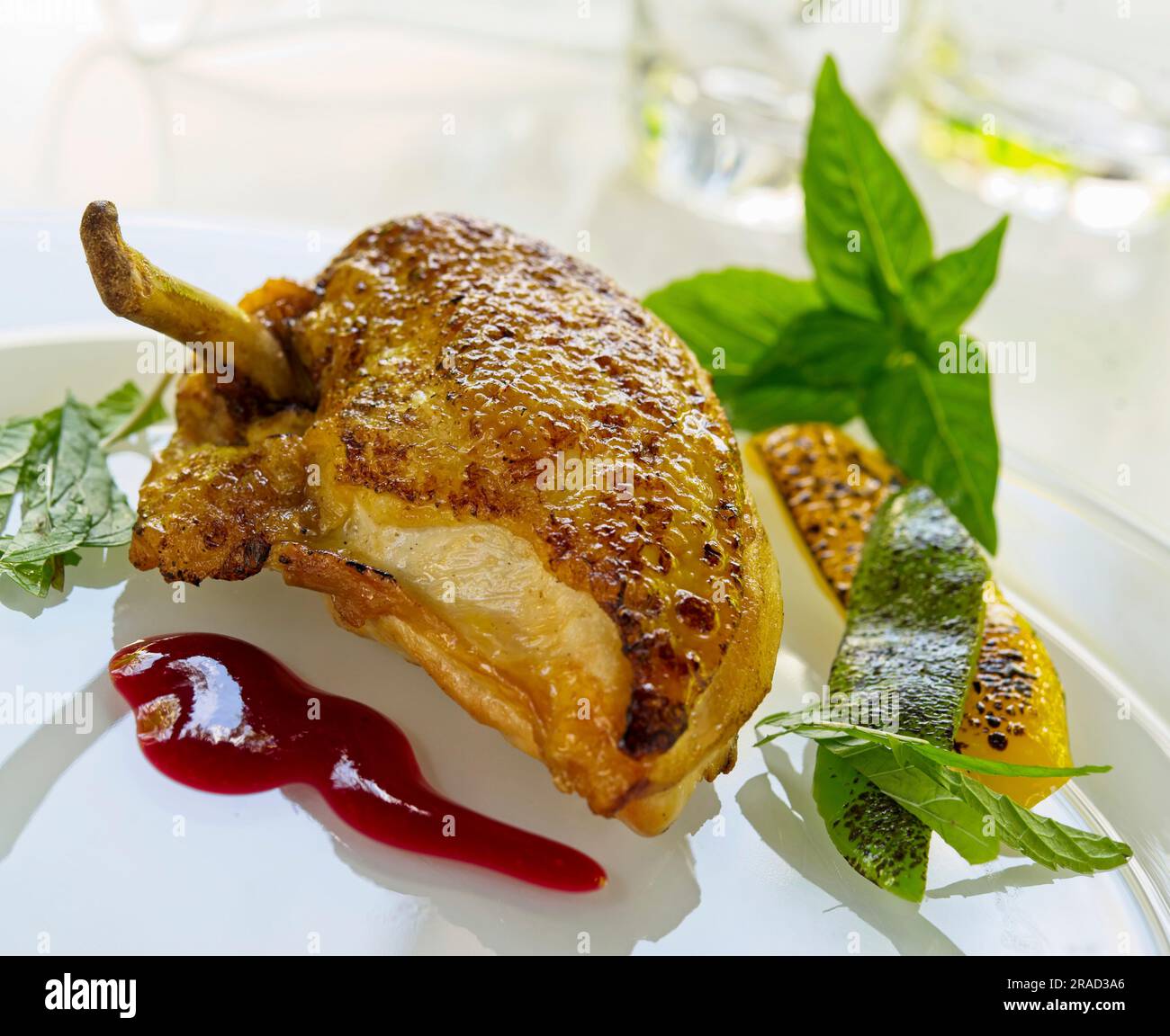 Confit chicken with Thai basil and paprika Stock Photo - Alamy