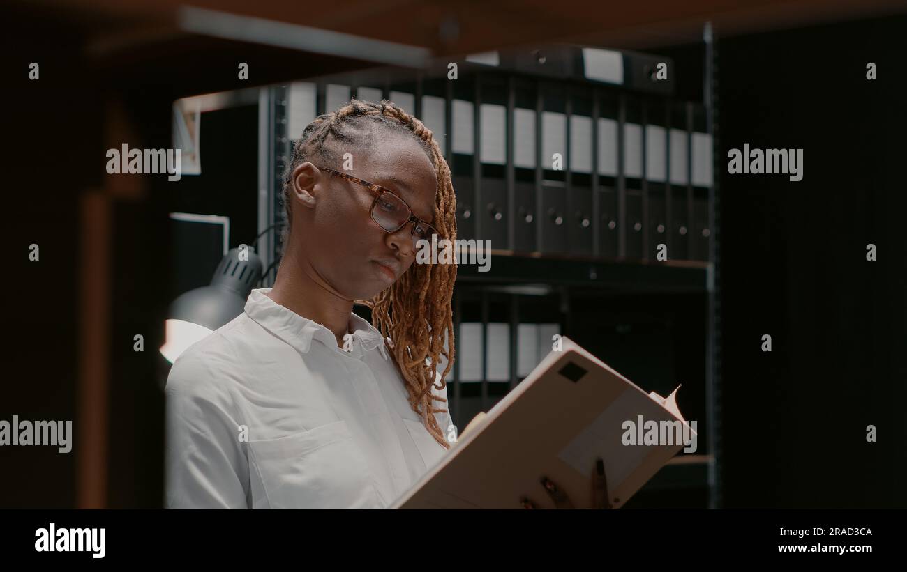 Private detective analyzing gathered case clues in incident room ...
