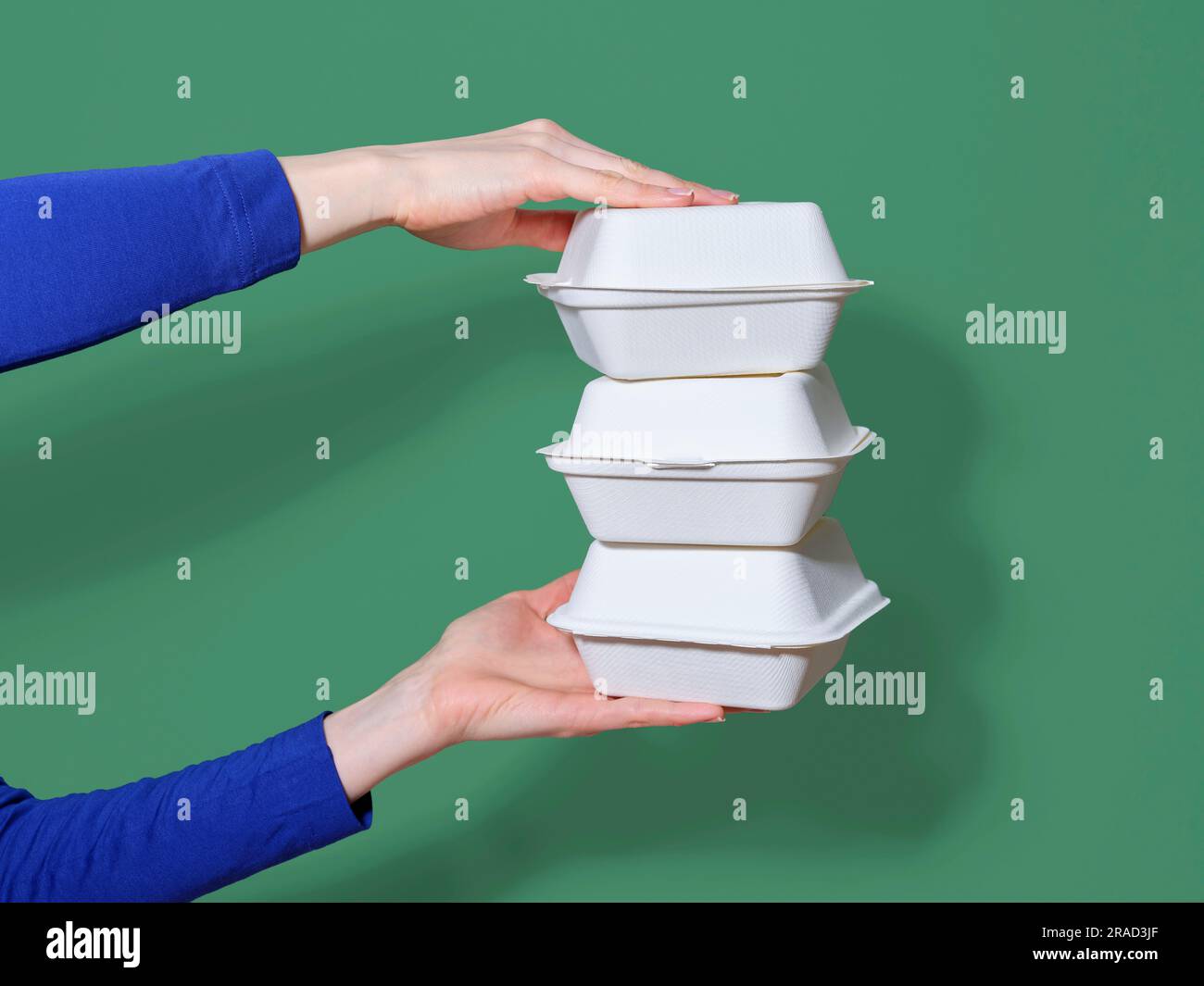 Take-out boxes for burgers in front of a green background Stock Photo ...