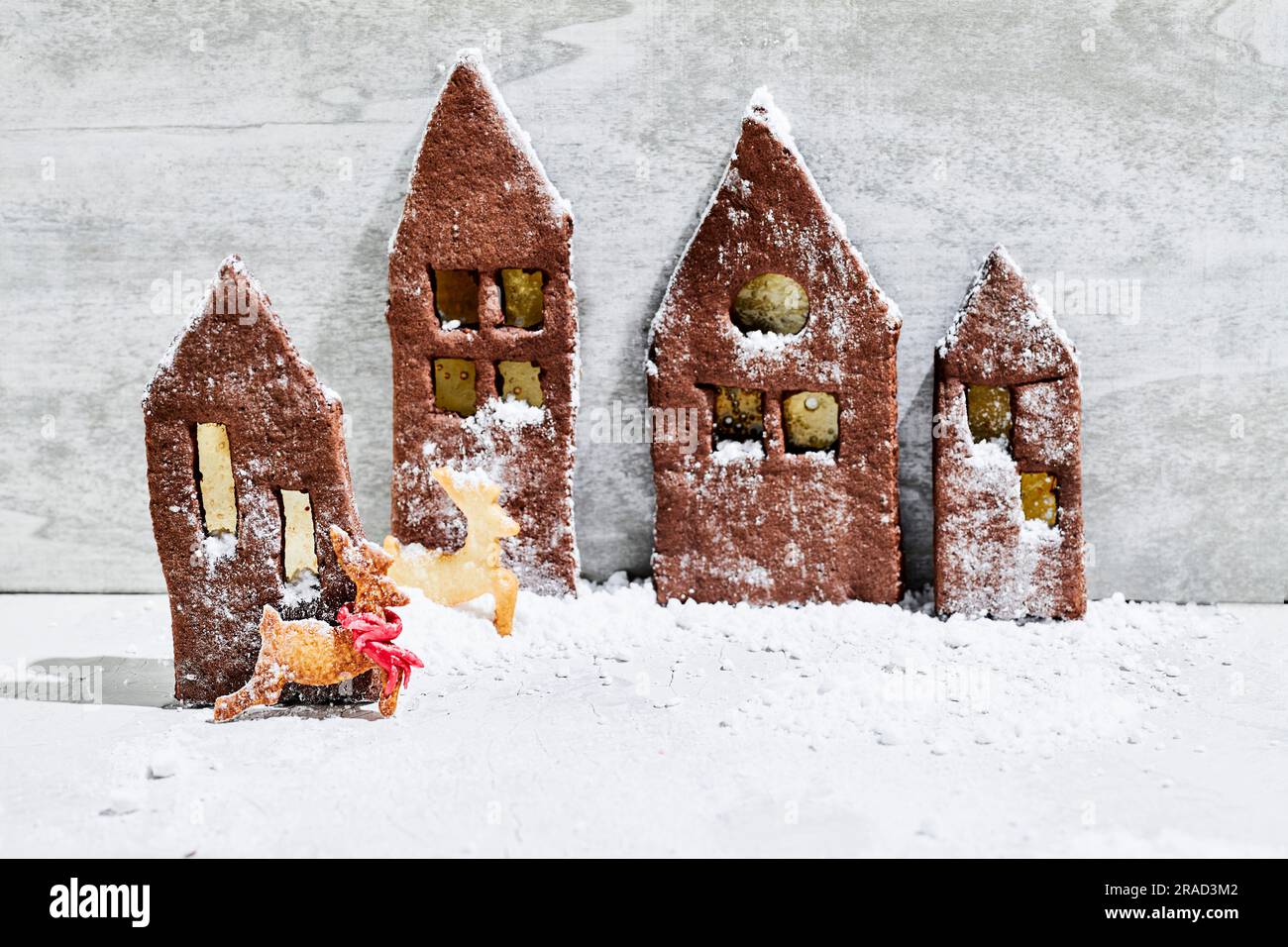 Gingerbread house biscuits in the snow Stock Photo - Alamy